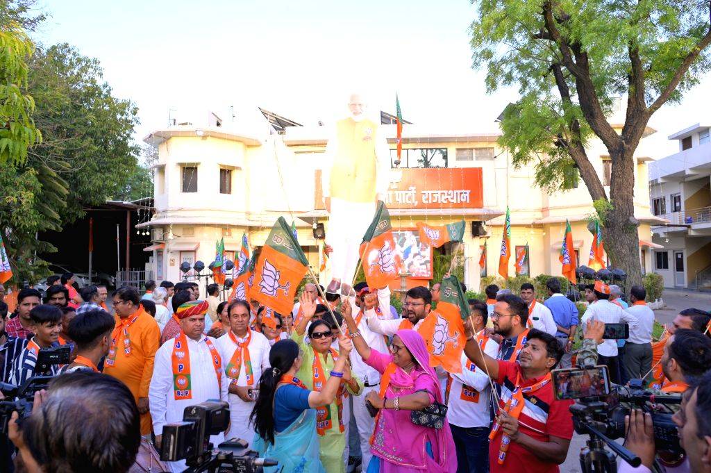 BJP workers celebrate as Prime Minister Narendra Modi becomes Prime ...