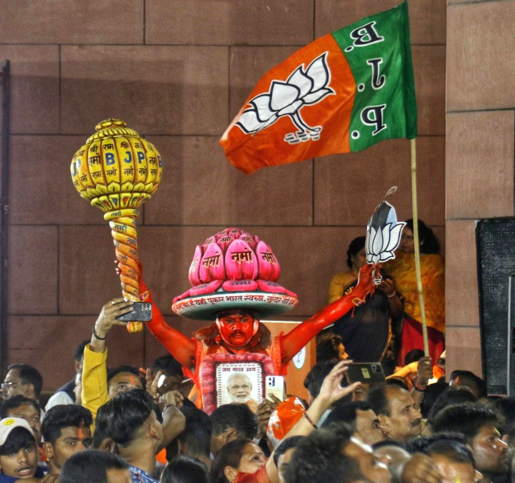 :New Delhi:BJP workers celebrate during celebrations after the party's ...
