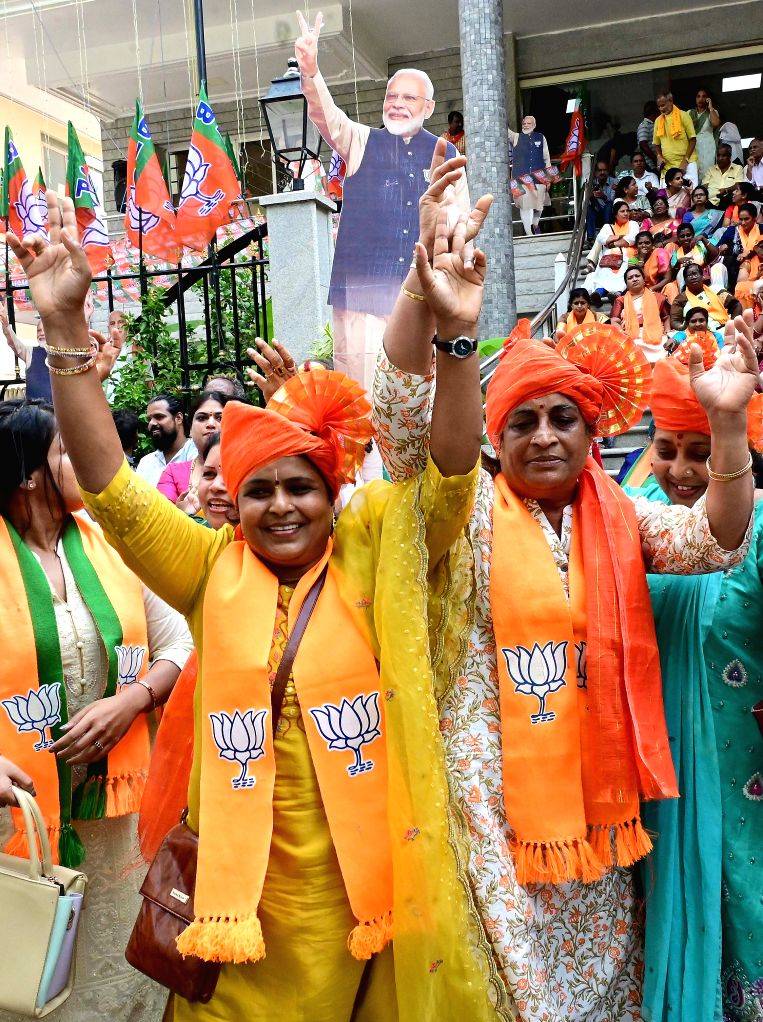 BJP workers celebrate the party's lead during counting of votes for Lok ...