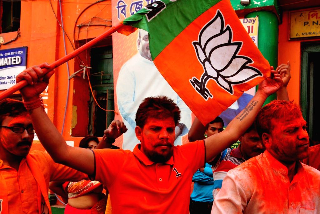 BJP workers celebrate the party's performance in the recently concluded ...