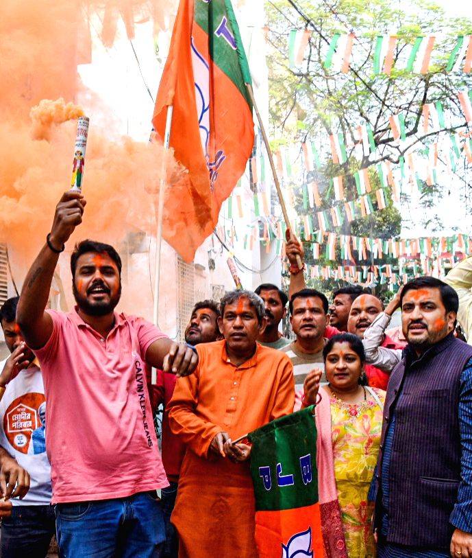 BJP workers celebrate the party's victory in the Delhi Assembly elections