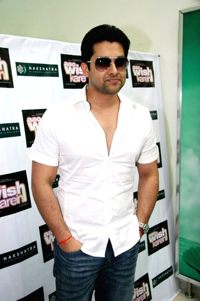 Bollywood Actor Aftab Shivdasani poses for the photographers during the ...