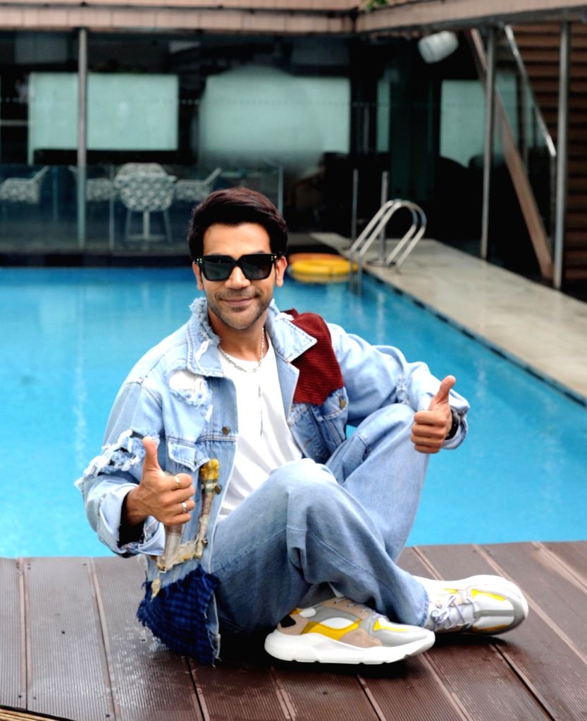 Bollywood actor Rajkummar Rao poses for the photographers