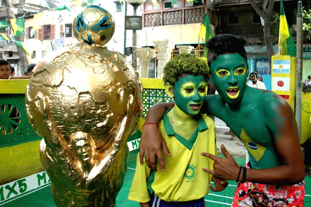 Brazilian football fans painting their face