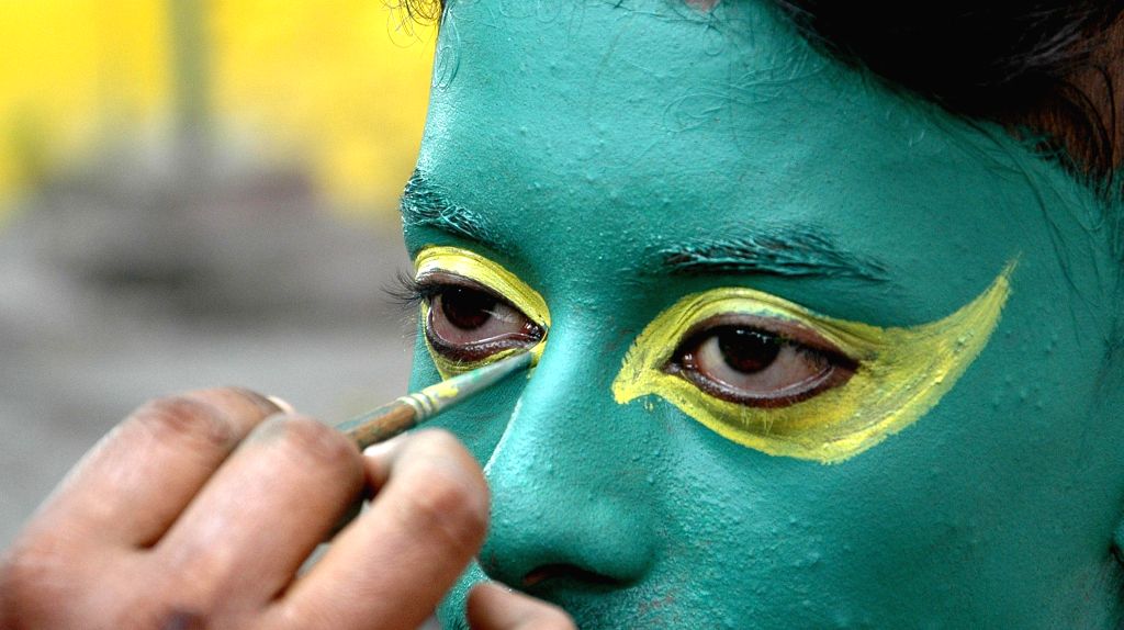 Brazilian football fans painting their face