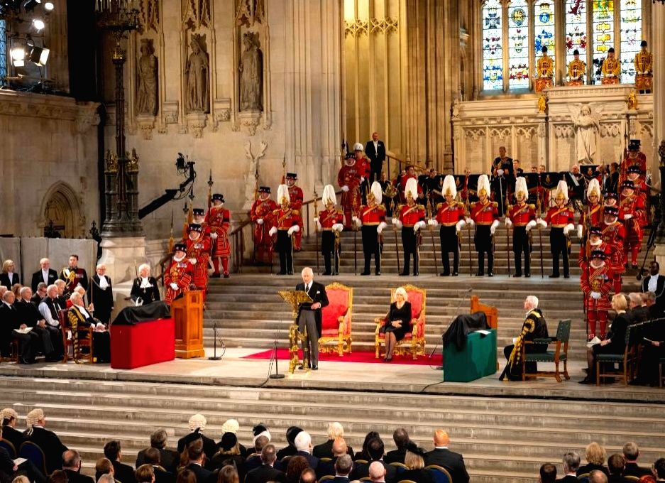 Britain's King Charles III (C) delivers his first address to the ...