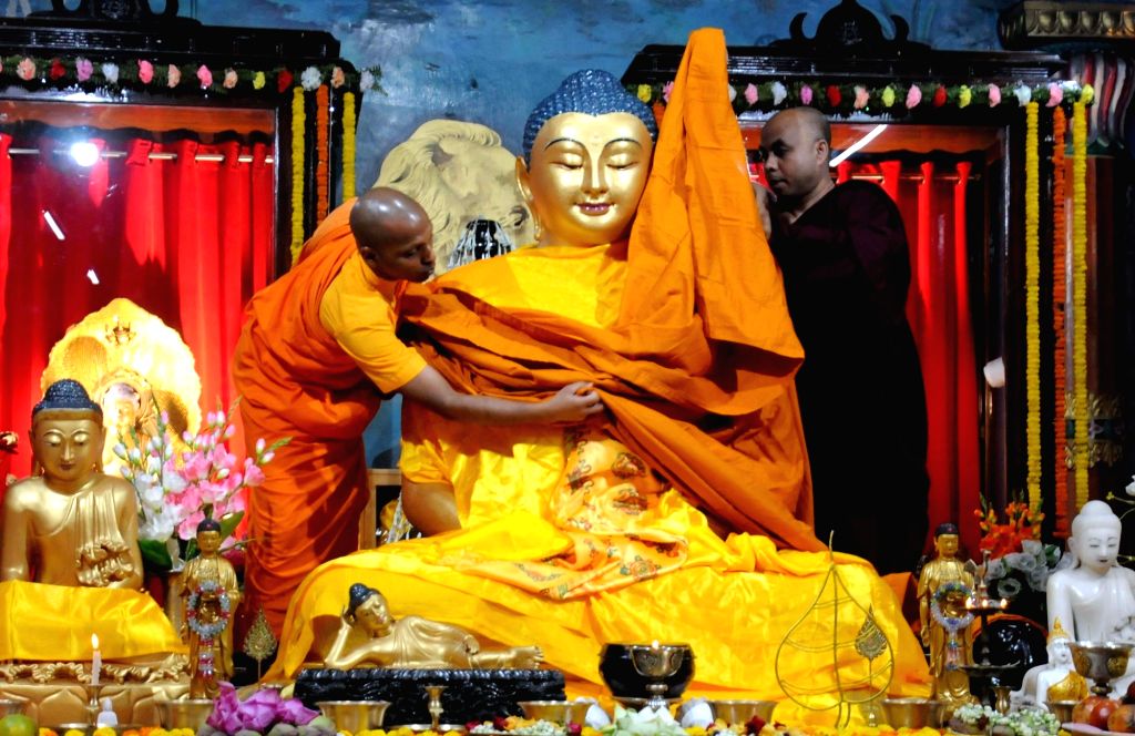 Buddhist monks offer prayers to Lord Buddha on the occasion of Buddha ...