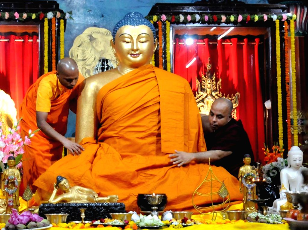 Buddhist monks offer prayers to Lord Buddha on the occasion of Buddha ...