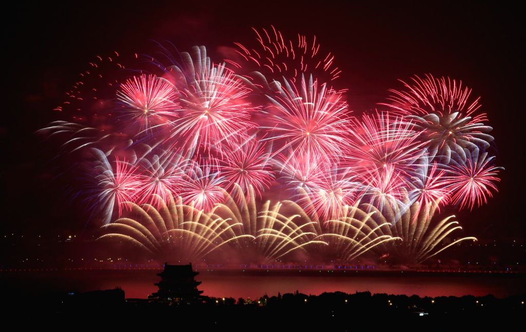 Fireworks blaze in the sky over the Xiangjiang River