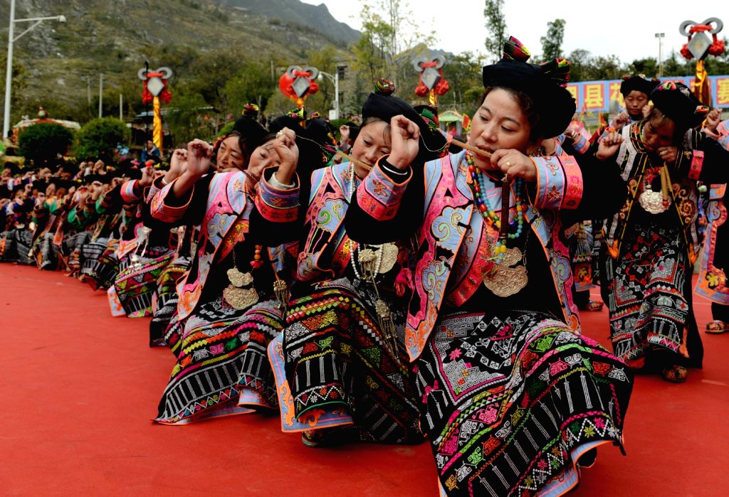 People of Qiang ethnic group play musical instrument to celebrate their ...