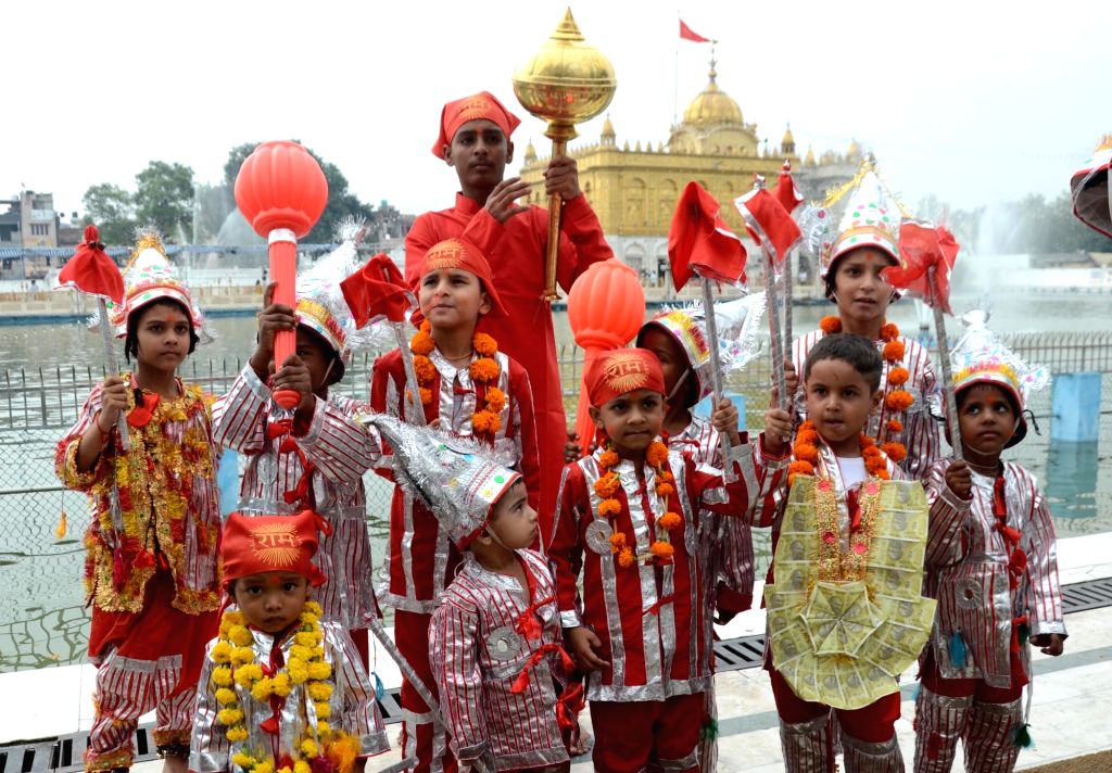 Children dressed as langur, a species of monkey, visit the historical ...