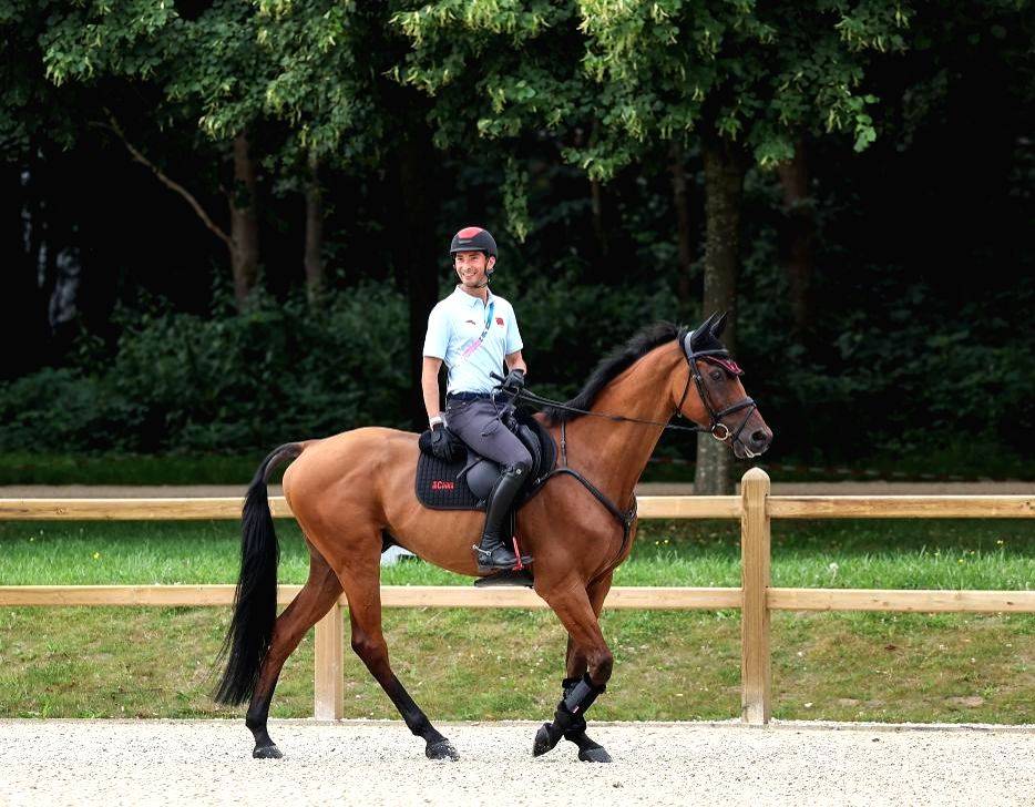 Chinese equestrian athlete Hua Tian takes part in a training session ...