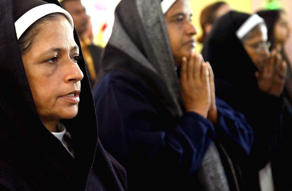 Christian devotees attend a prayer at Mariam Nagar Church on the ...