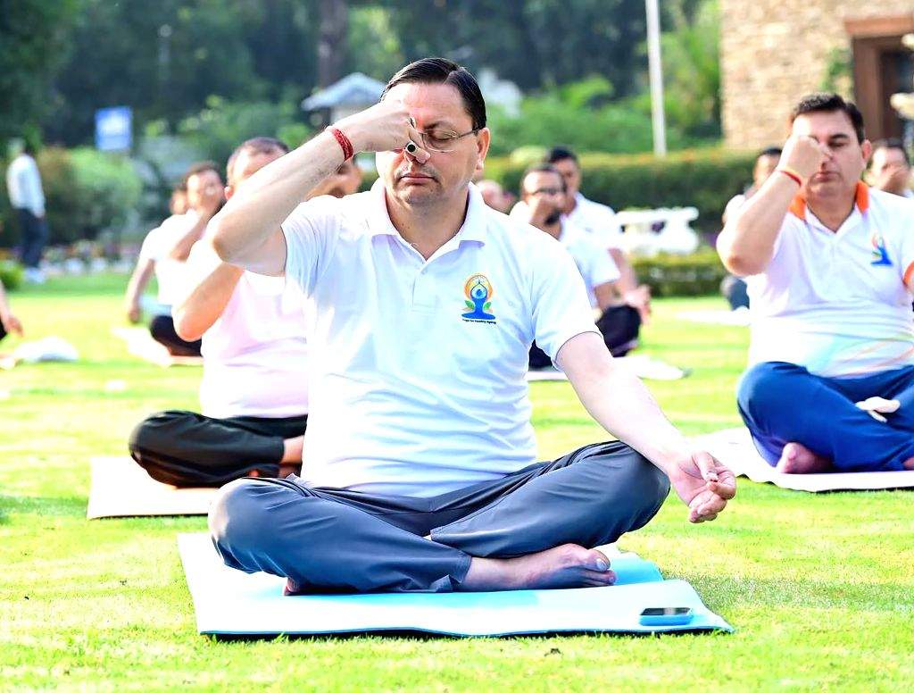 CM Dhami performs yoga ahead of International Yoga Day