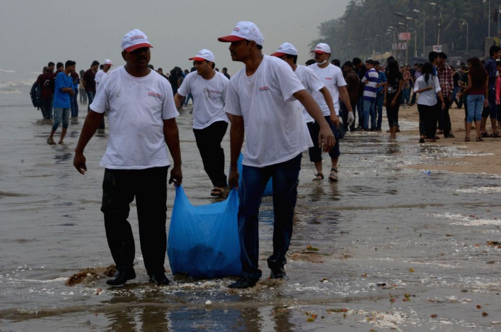 College students and NGO workers clean up Juhu beach