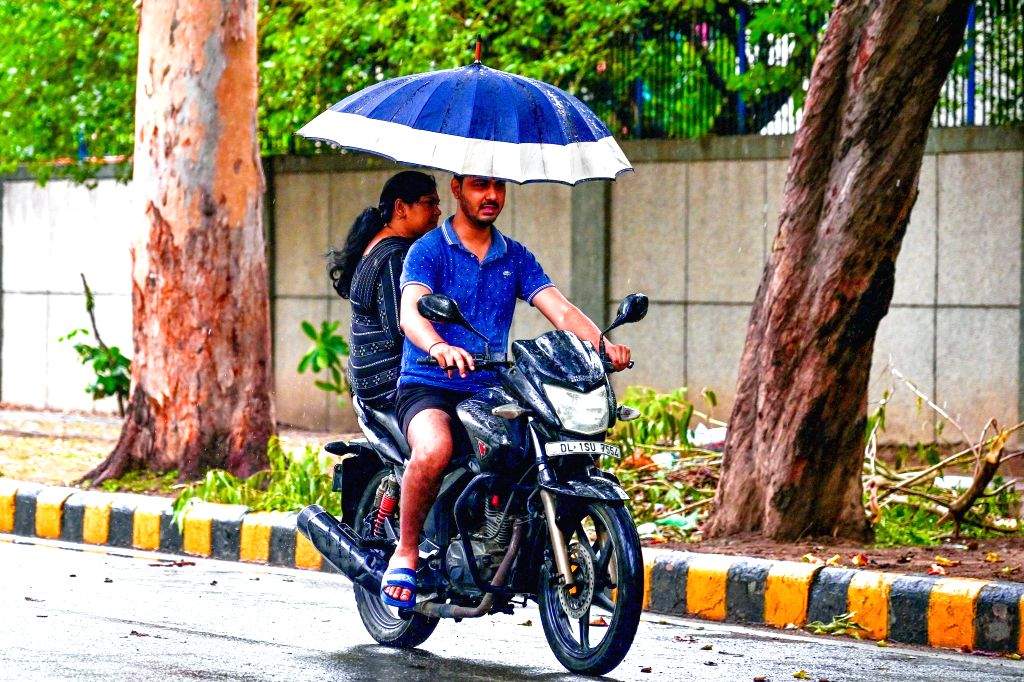 Commuters Make Their Way Amid Rain