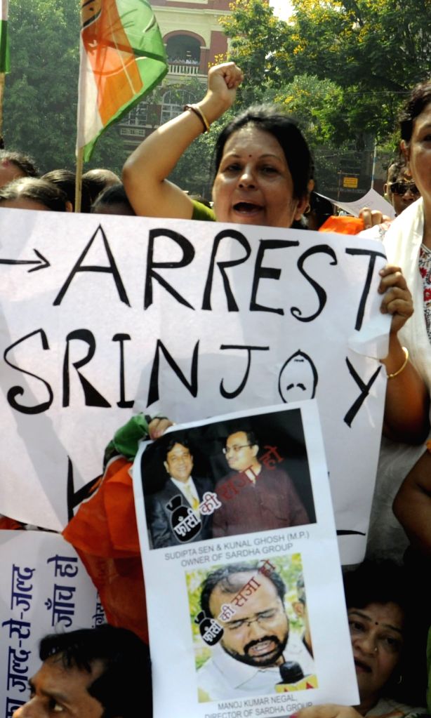 Congress activists at a protest rally against the chit fund scam