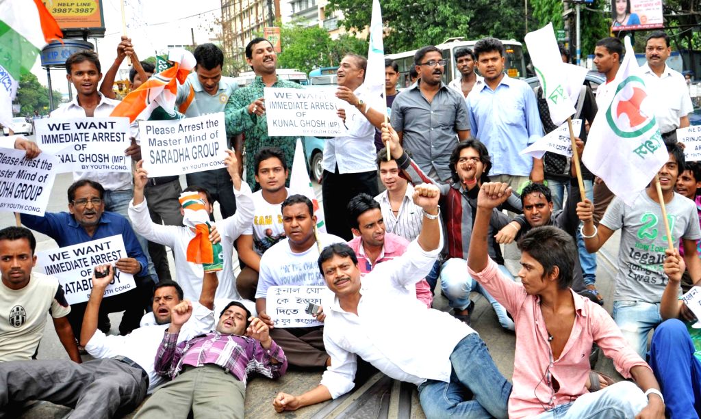 Congress activists during a protest against chit fund scam
