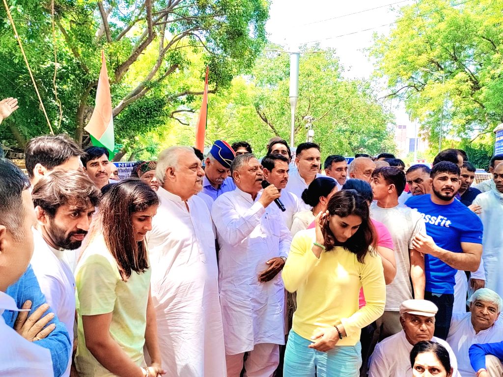 Congress leader Bhupinder Hooda interacts with wrestlers