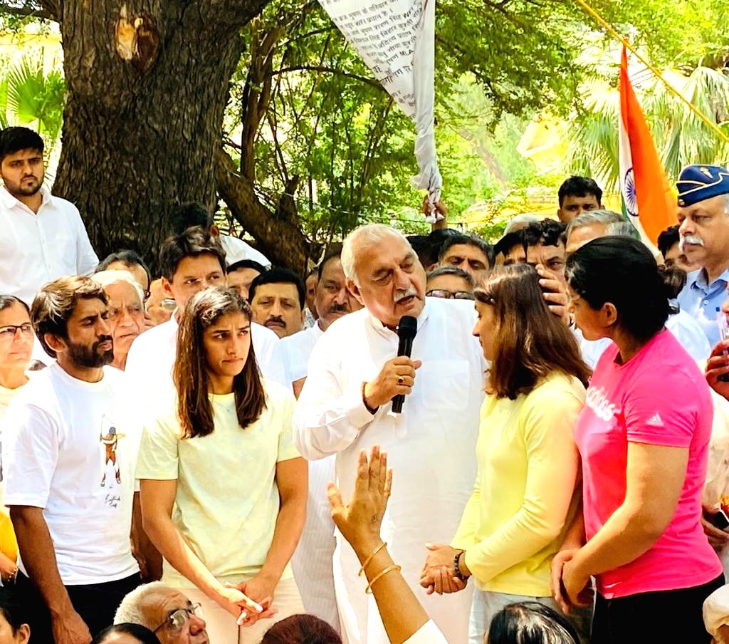 Congress leader Bhupinder Hooda interacts with wrestlers