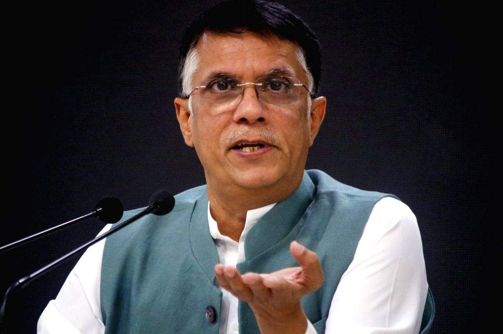 Congress leader Pawan Khera addresses a press conference