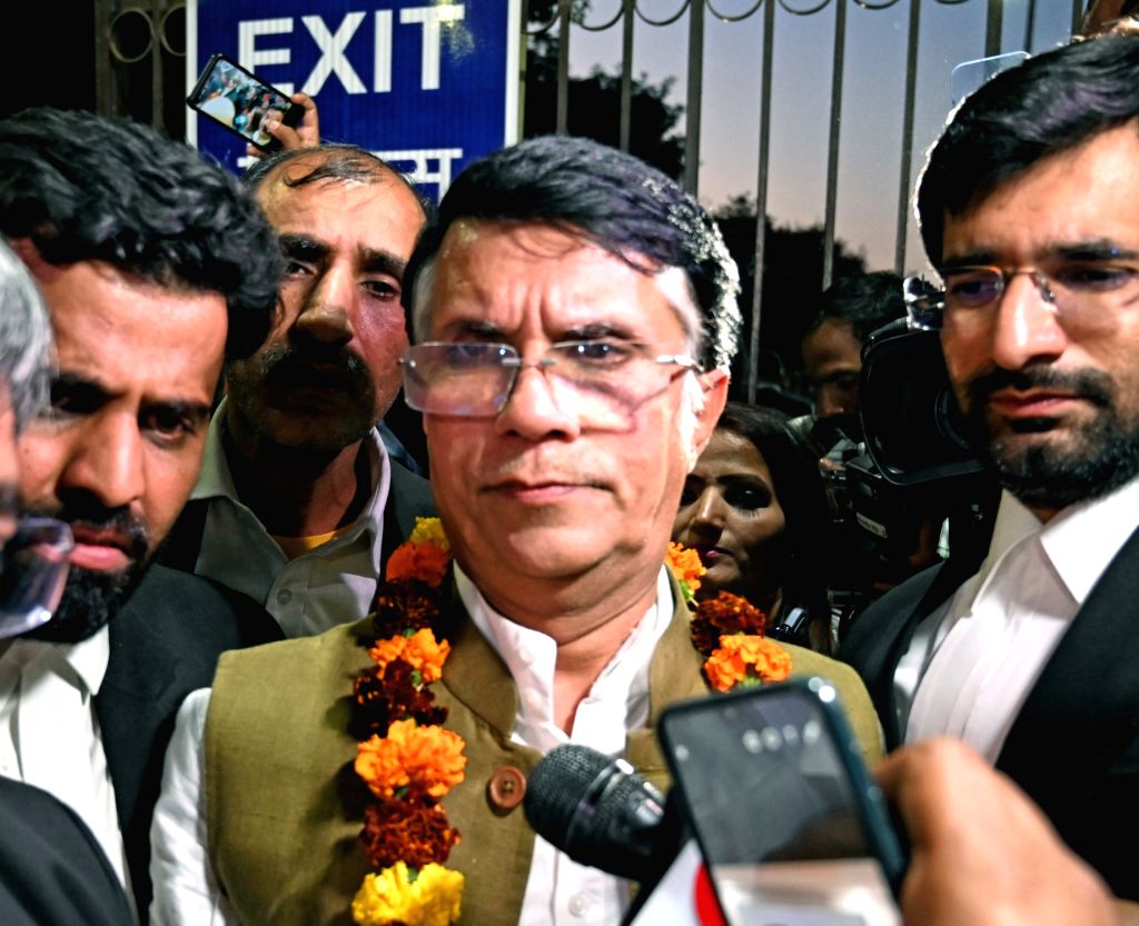 Congress leader Pawan Khera leaves from the Dwarka court