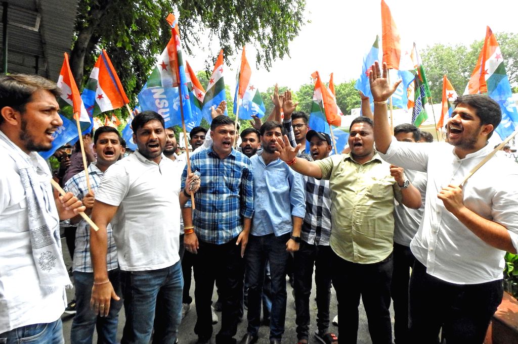 Congress party workers and supporters raise slogans in support of party ...