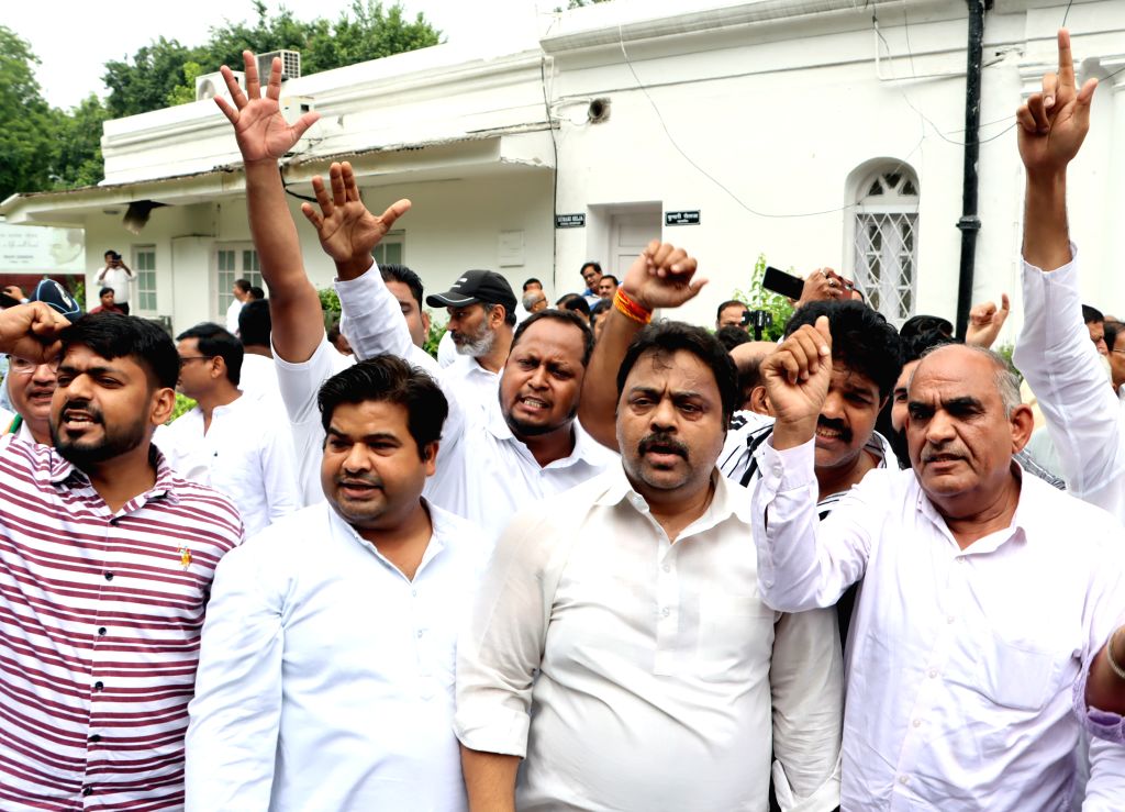 Congress party workers and supporters raise slogans in support of party ...