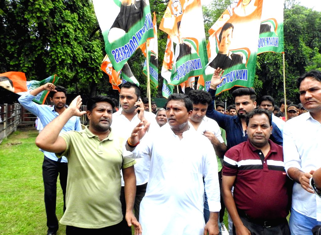 Congress party workers and supporters raise slogans in support of party ...