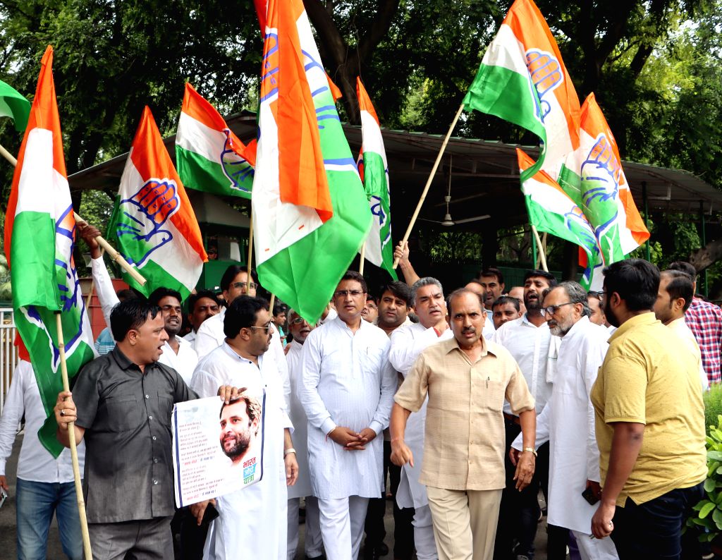 Congress party workers and supporters raise slogans in support of party ...