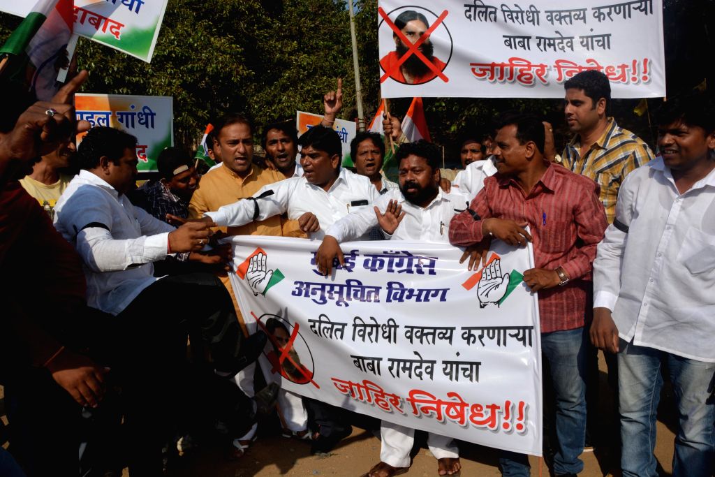 Congress Party workers protested against Baba Ramdev