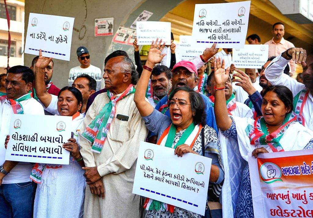 Congress party workers stage a protest against the alleged freezing of ...