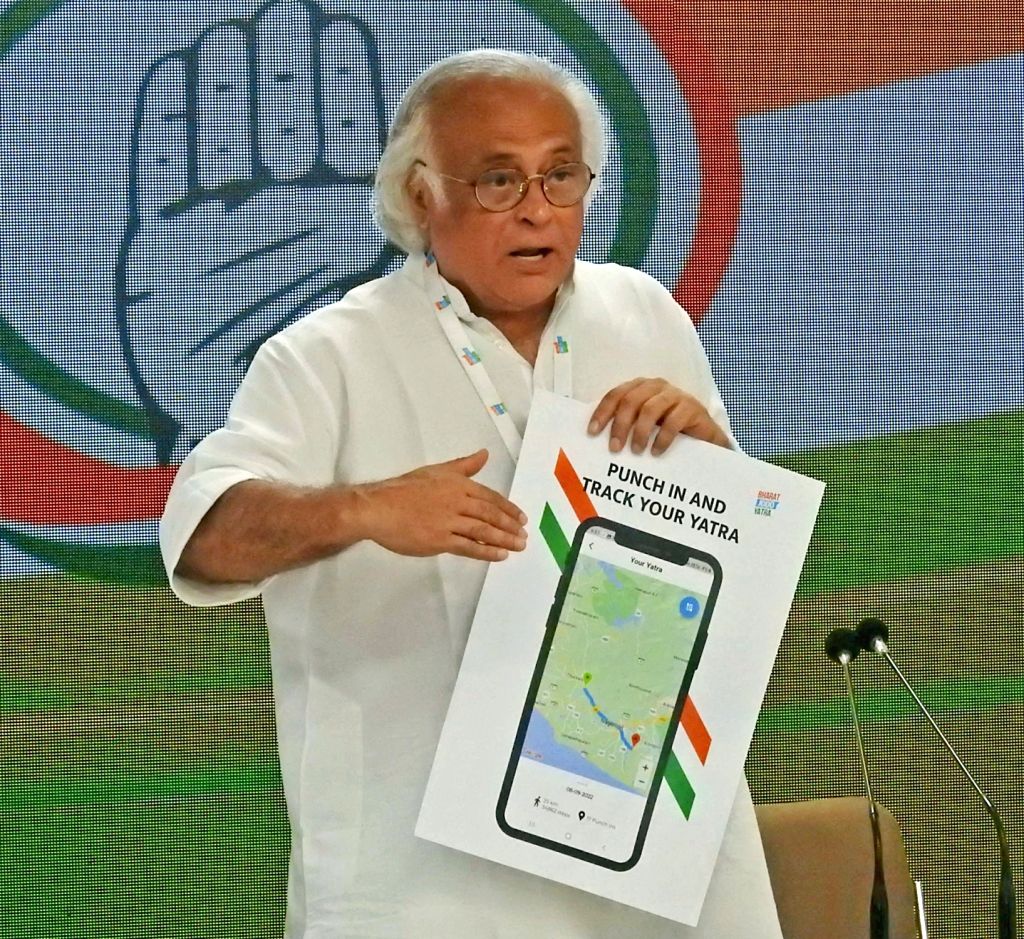 Congress senior leader Jairam Ramess shows an app to join 'Bharat Jodo ...