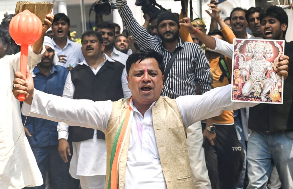 New Delhi : Congress supporters and workers celebrate after the party's ...