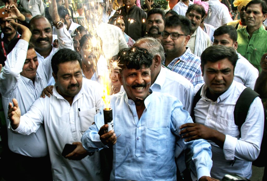 Congress workers and supporters celebrate for new