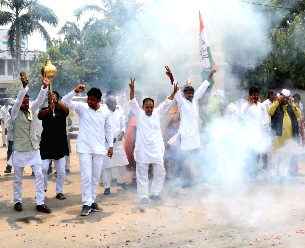 Congress workers celebrate after the party's decisive lead in the ...