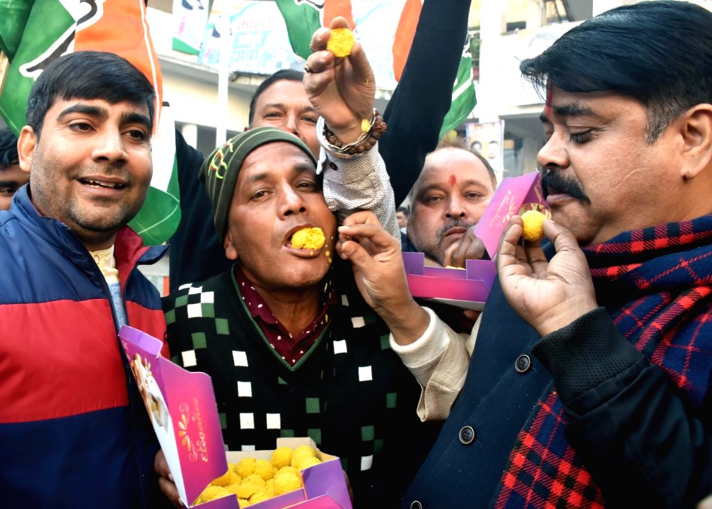 Congress workers celebrate for the partyâ s victory