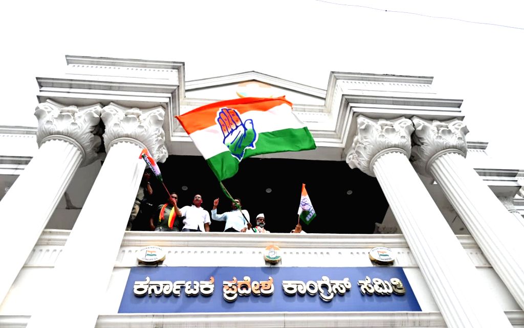 Bengaluru : Congress workers wave the party flag as they celebrate ...
