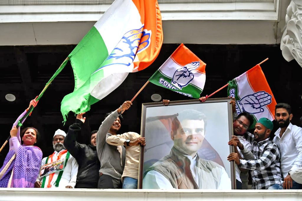 Bengaluru : Congress workers wave the party flag as they celebrate ...