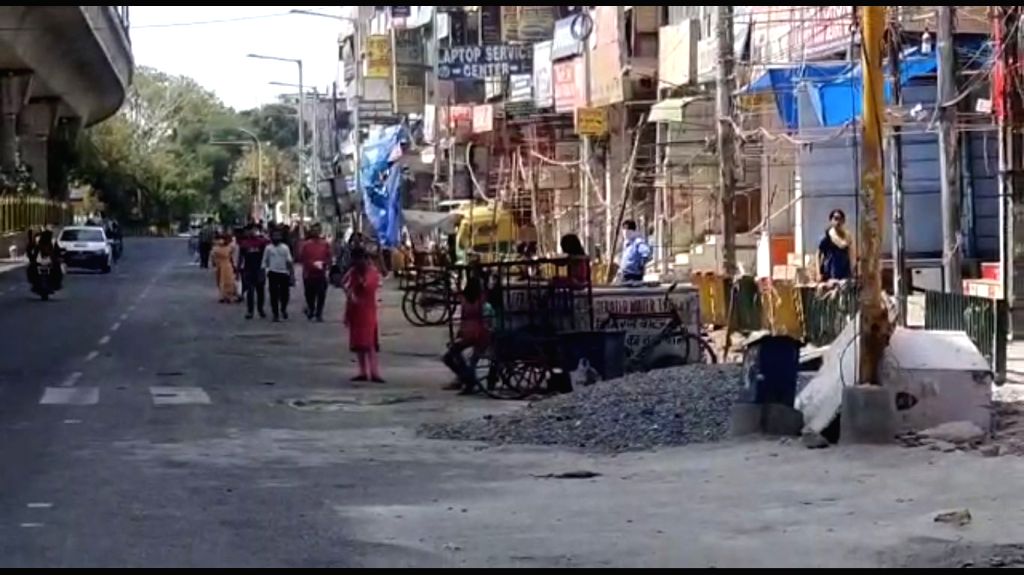Covid-19: Women, kids wait for ration, food on Noida streets