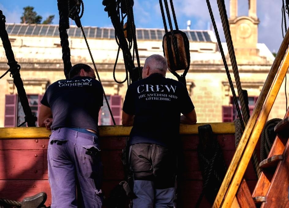 Crew members talk onboard the ship Gotheborg of Sweden in Valletta