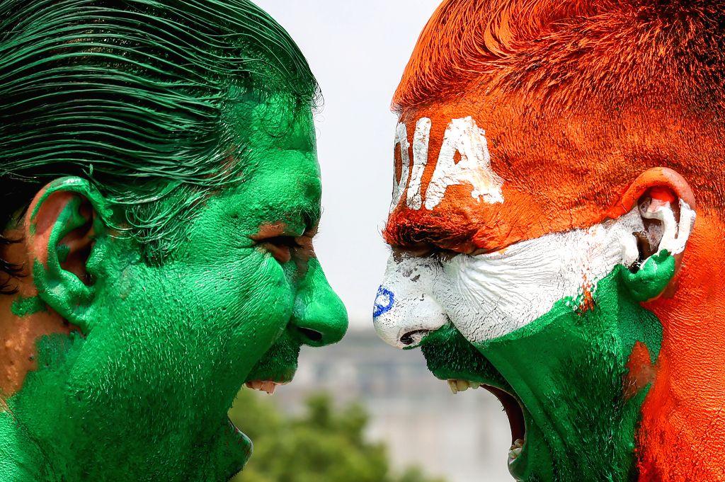 Cricket fans paint bodies in Indian and Pakistan flag colours ahead of ...