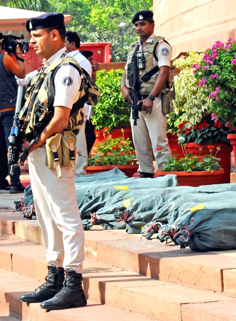 CRPF personnel stand guard near the budget copies at Parliament