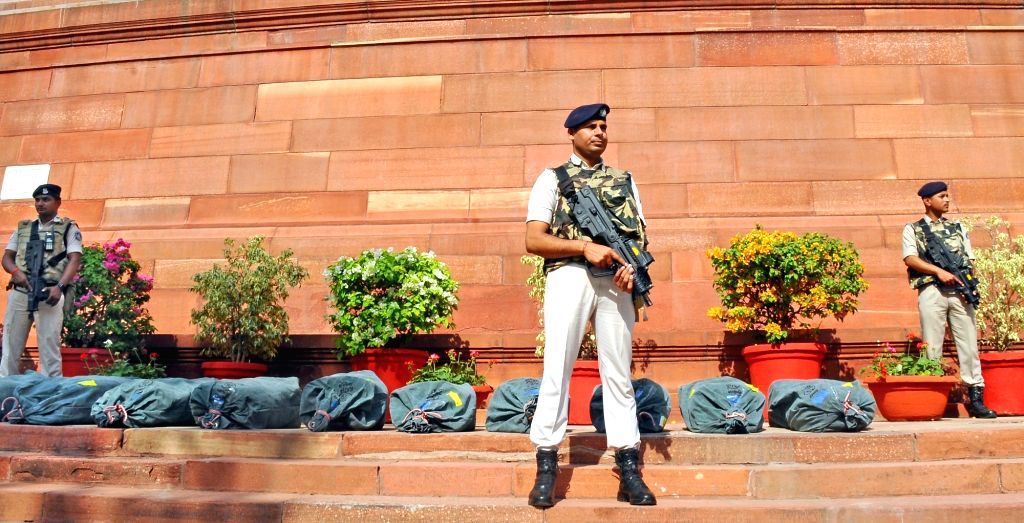 CRPF personnel stand guard near the budget copies at Parliament