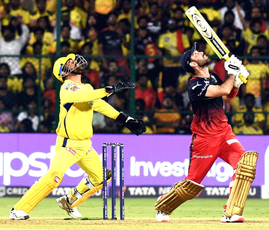 Bangalore : CSK captain MS Dhoni attempts a catch of RCB batsman Glenn ...