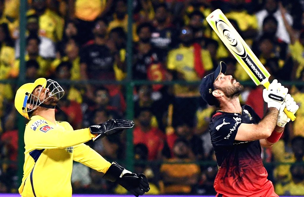 Bangalore : CSK captain MS Dhoni attempts a catch of RCB batsman Glenn ...