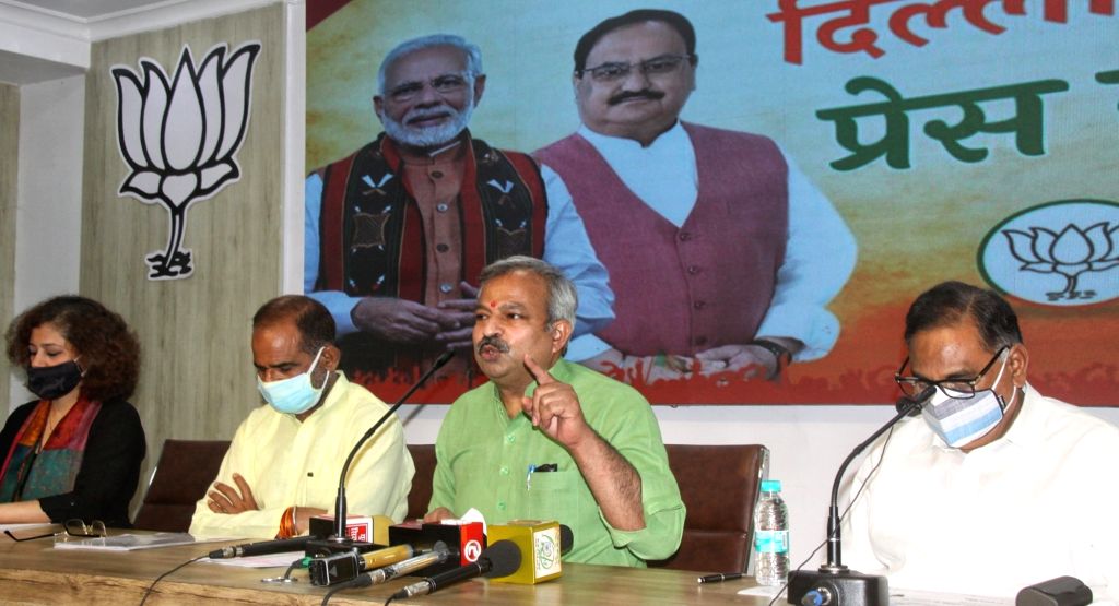 : New Delhi: Delhi BJP President Adesh Gupta, LOP Ramvir Singh Bidhuri ...