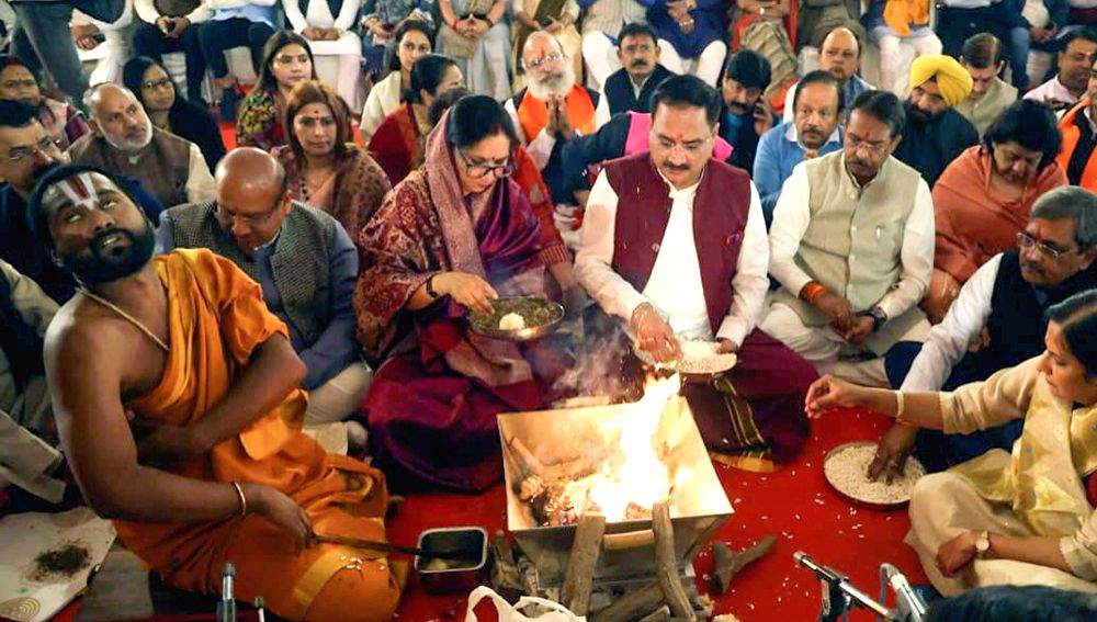 Delhi BJP President Virendra Sachdeva, along with his wife and other ...