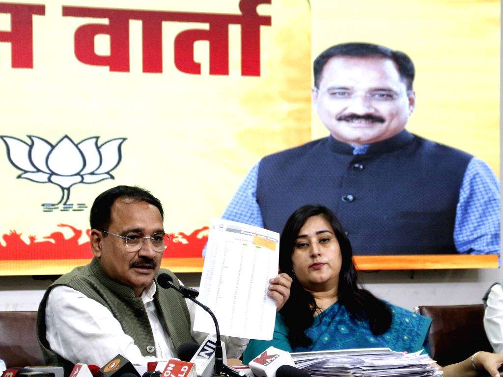 Delhi BJP President Virendra Sachdeva and MP Bansuri Swaraj address a ...