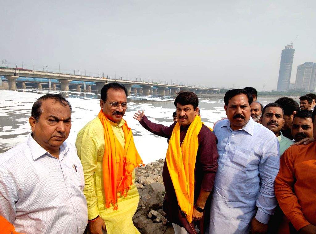Delhi BJP president Virendra Sachdeva and party leader Manoj Tiwari ...